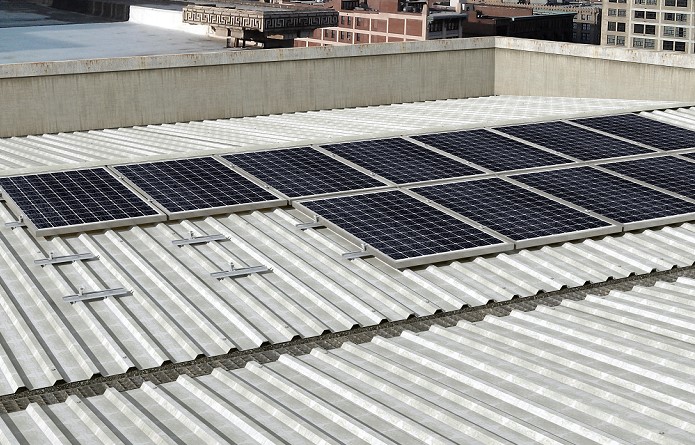 Pitched roof with trapezoidal metal sheets covering